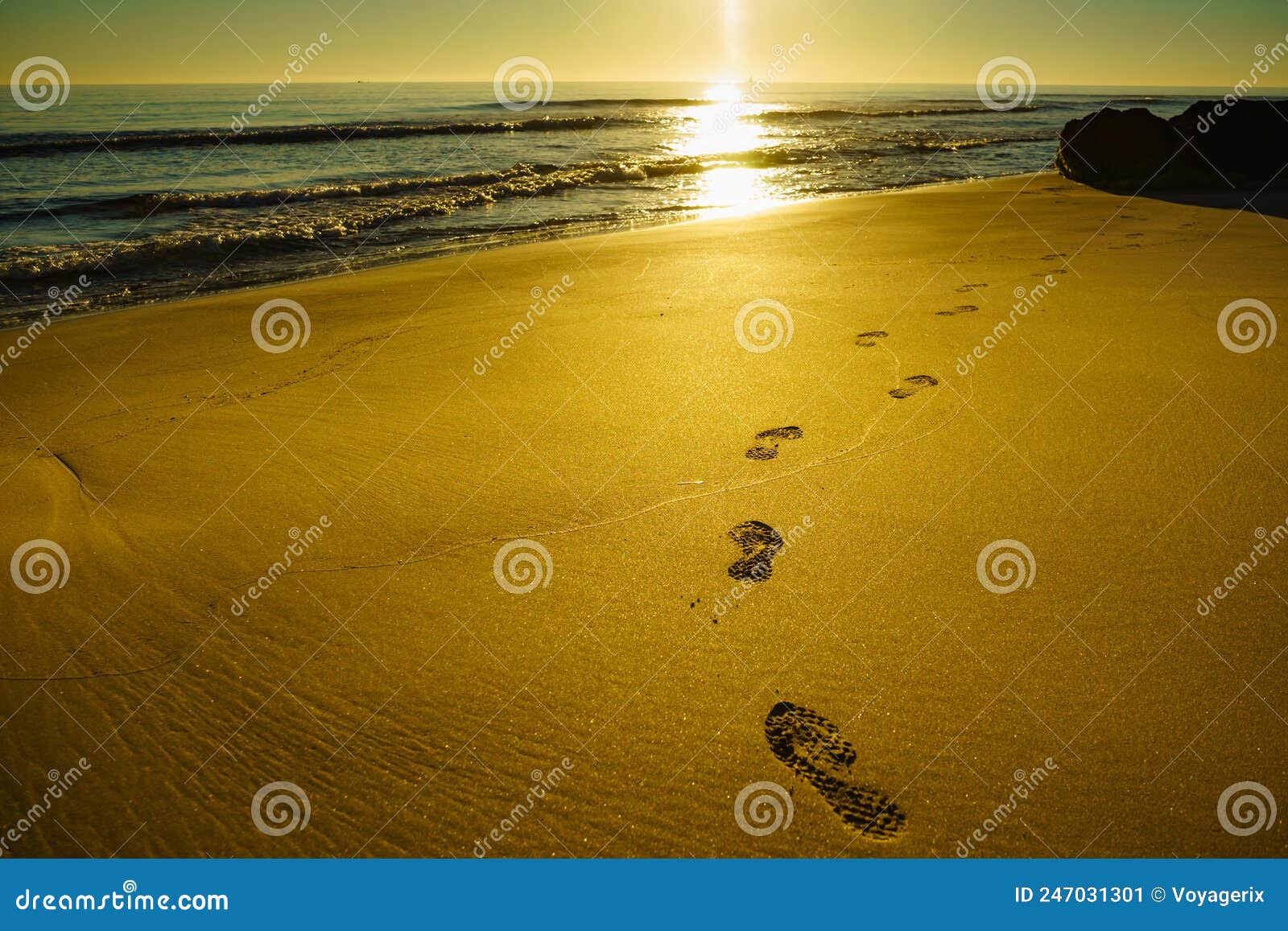 Sunset and Footprints on Beach Stock Image - Image of shore, coastline ...