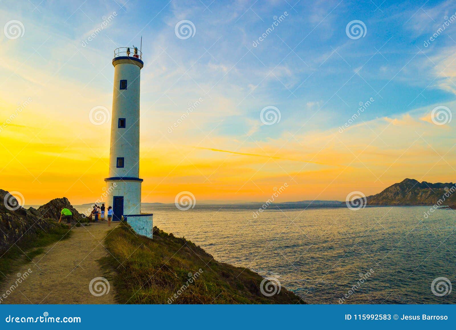 Sunset in Front of Lighthouse on the Rocks. Beautiful Scene at T ...
