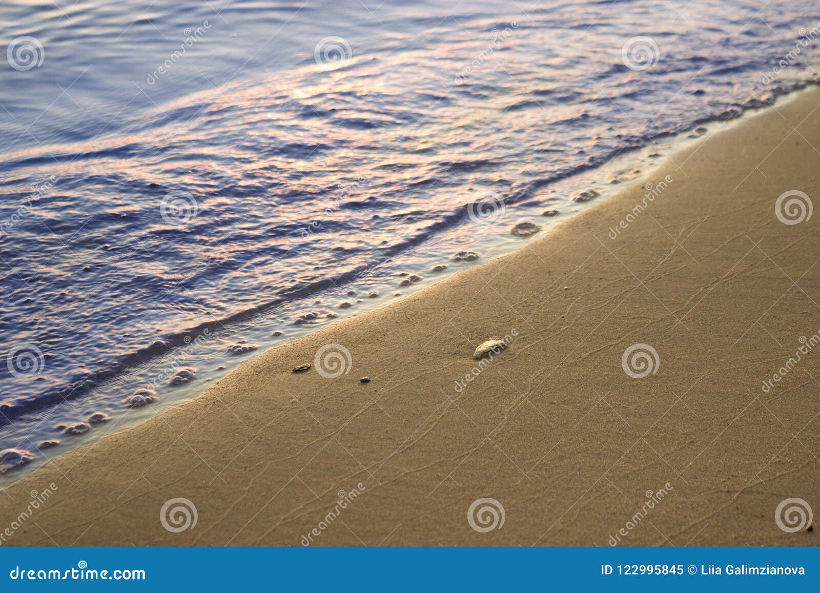 Sunset and Gentle Surf stock image. Image of texture - 122995845