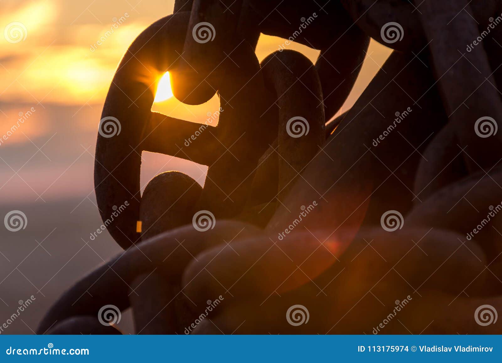 Sunset Glowing through a Link of an Anchor Chain Stock Photo - Image of ...