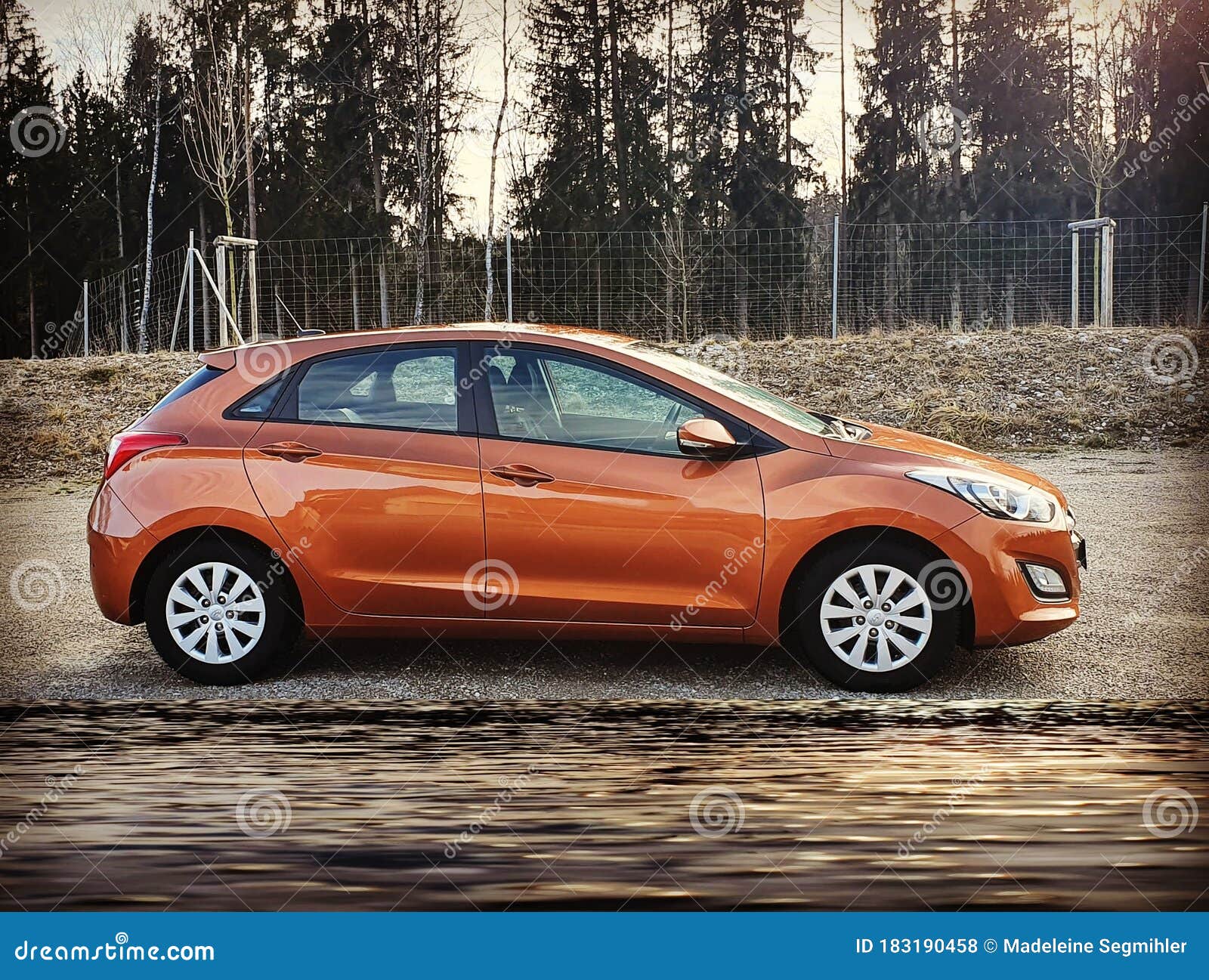 Orange metallic car editorial stock photo. Image of vehicle - 183190458