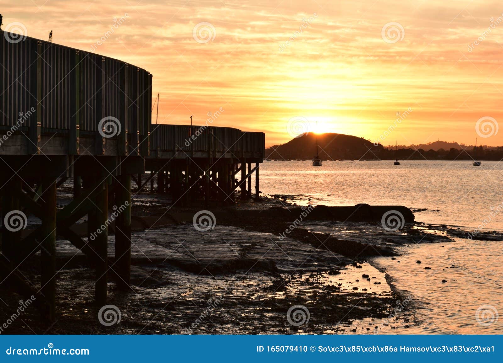 Sunset in Half Moon Bay in Auckland Stock Photo - Image of view ...
