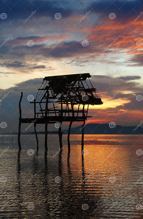 Sunset with Hut Silhouette. Stock Photo - Image of asia, flamboyant ...
