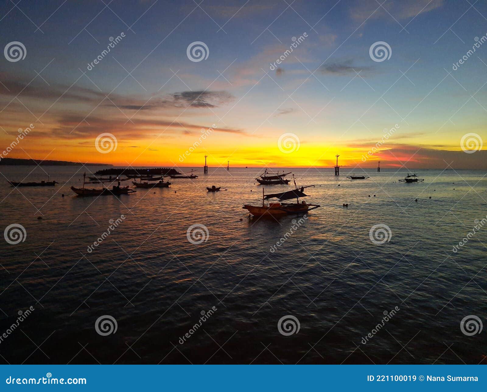 Sunset at Jimbaran Bali stock image. Image of jimbaran - 221100019