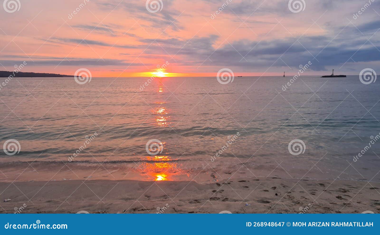 Sunset at Jimbaran beach stock image. Image of cloud - 268948647