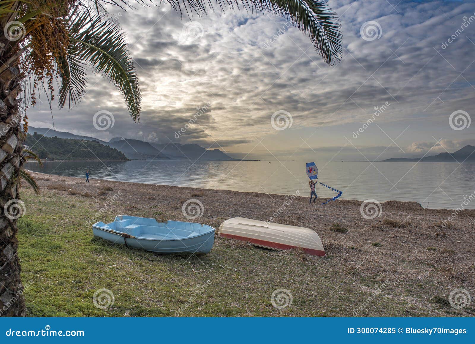 Sunset. Kids Playing at the Beach in Arkitsa Under a Dramatic ...