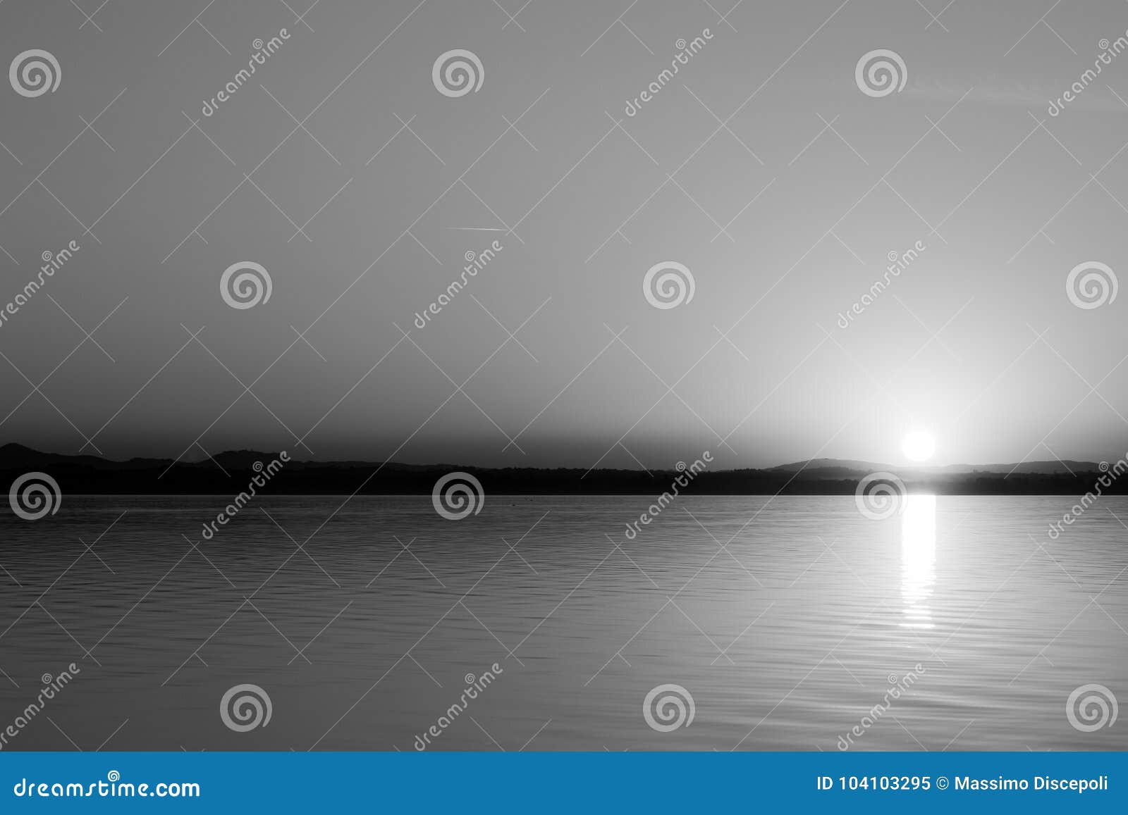 Sunset on a Lake, with Sun Low on the Horizon Stock Image - Image of ...