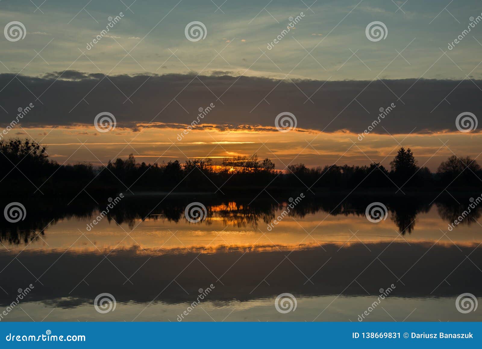 Sunset on the Lake, Trees on the Shore and Reflection of Cloud in the ...