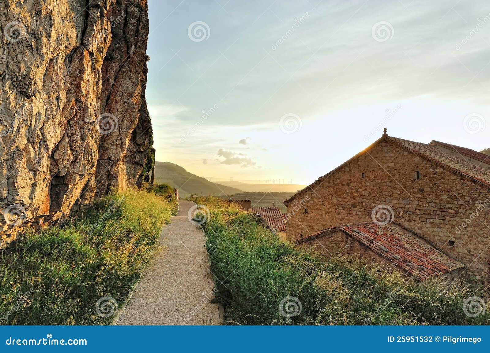 Sunset Landscape with Big Rock and Roofs in Ares. Stock Photo - Image ...