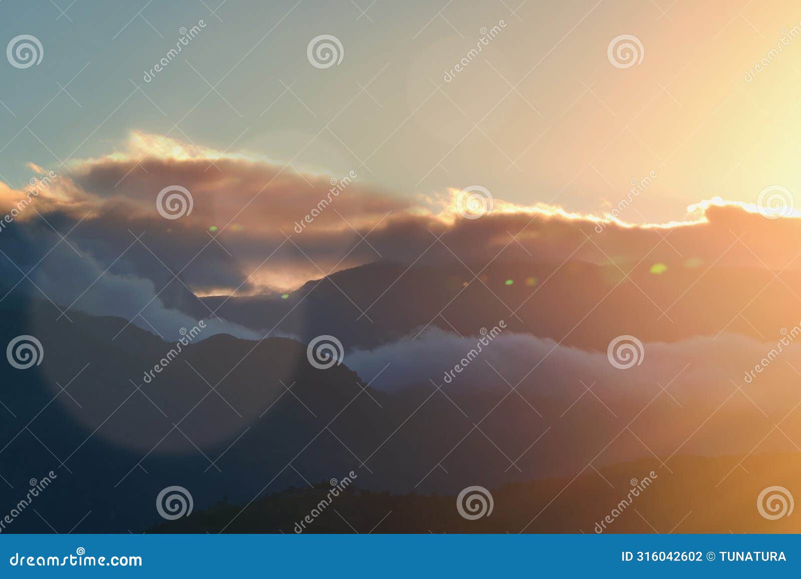 Sunset Landscape with Lens Flare, Mountains and Clouds As an Background ...