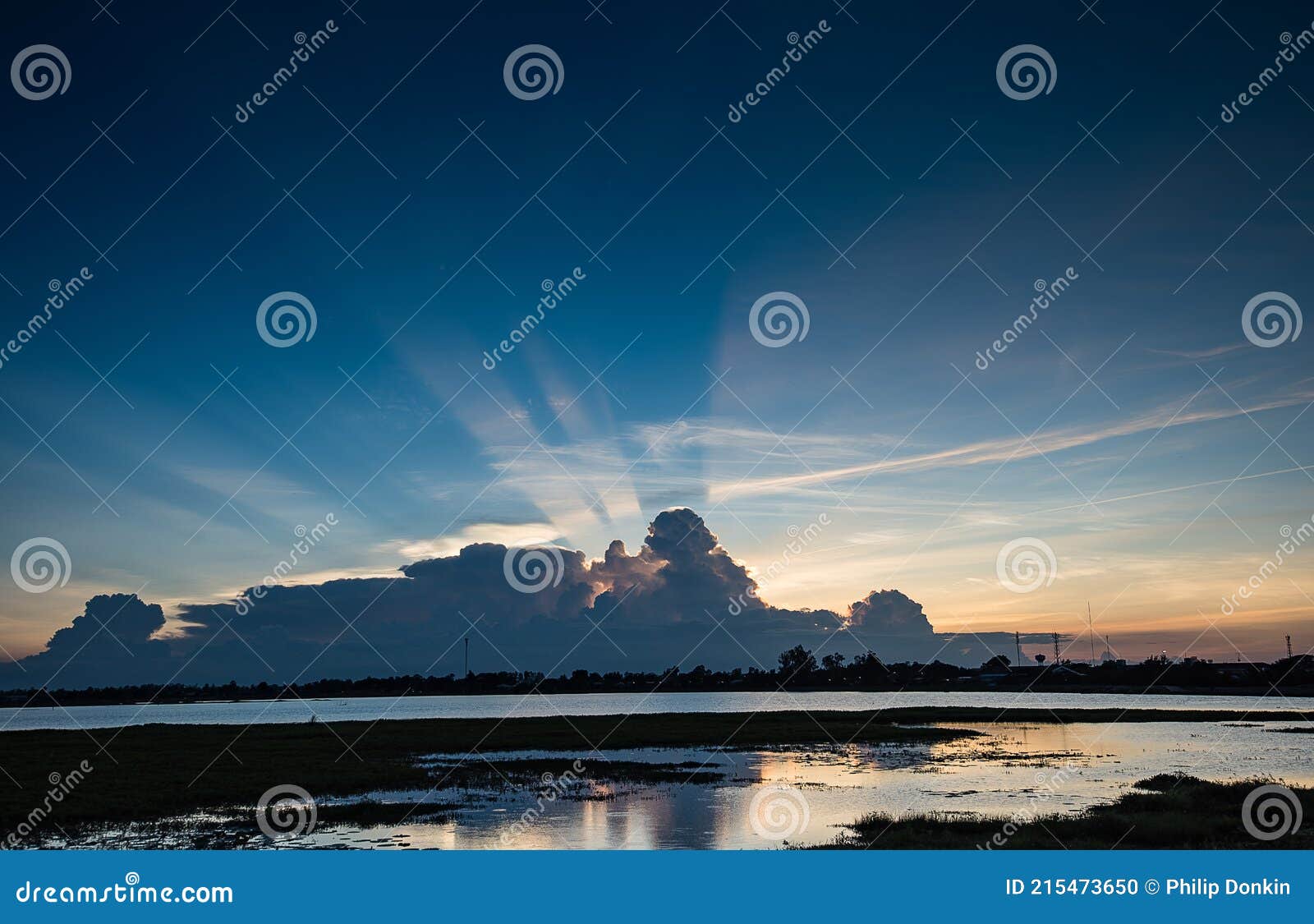 Sunset with Light Streaks and Half of Sky Lit by Setting Sun Stock ...