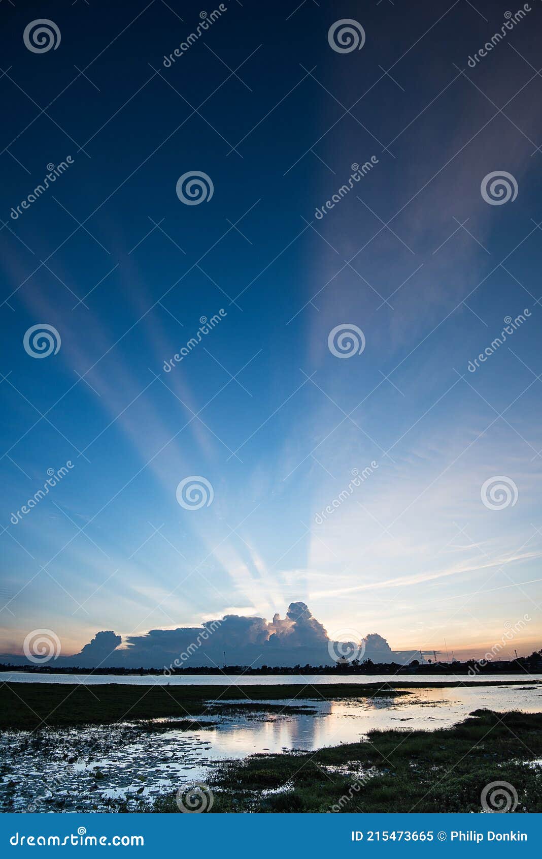 Sunset with Light Streaks and Half of Sky Lit by Setting Sun Stock ...