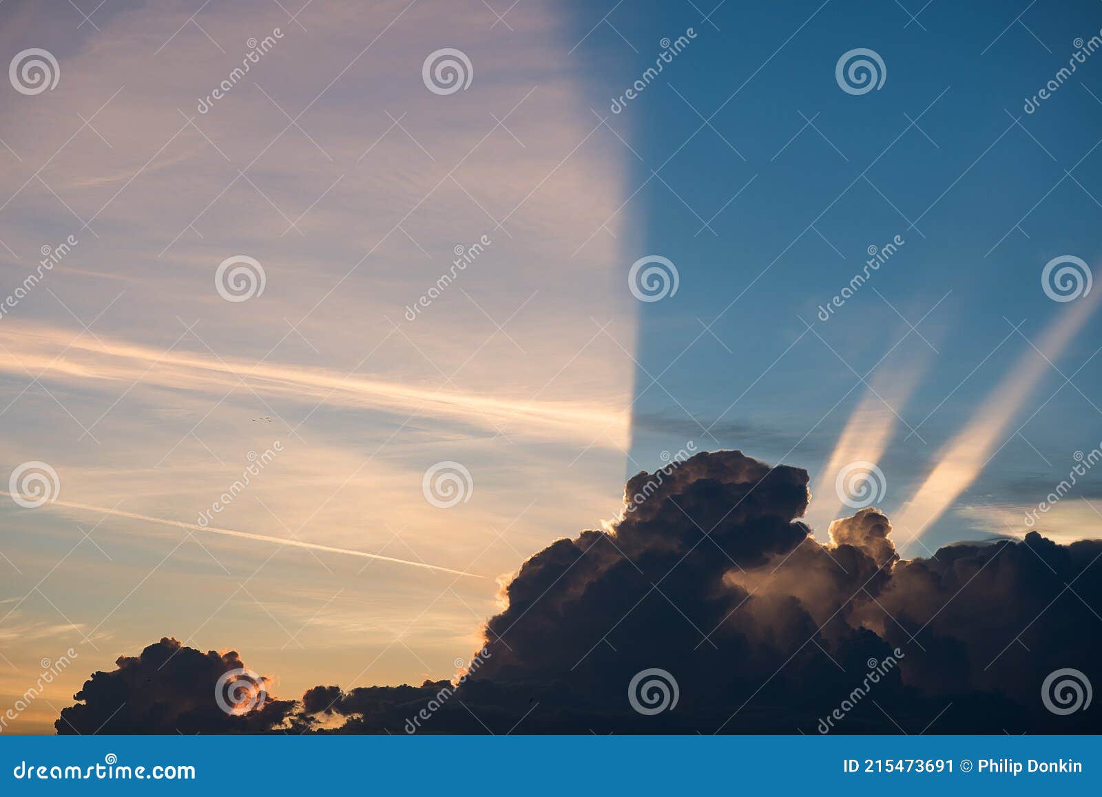 Sunset with Light Streaks and Half of Sky Lit by Setting Sun Stock ...