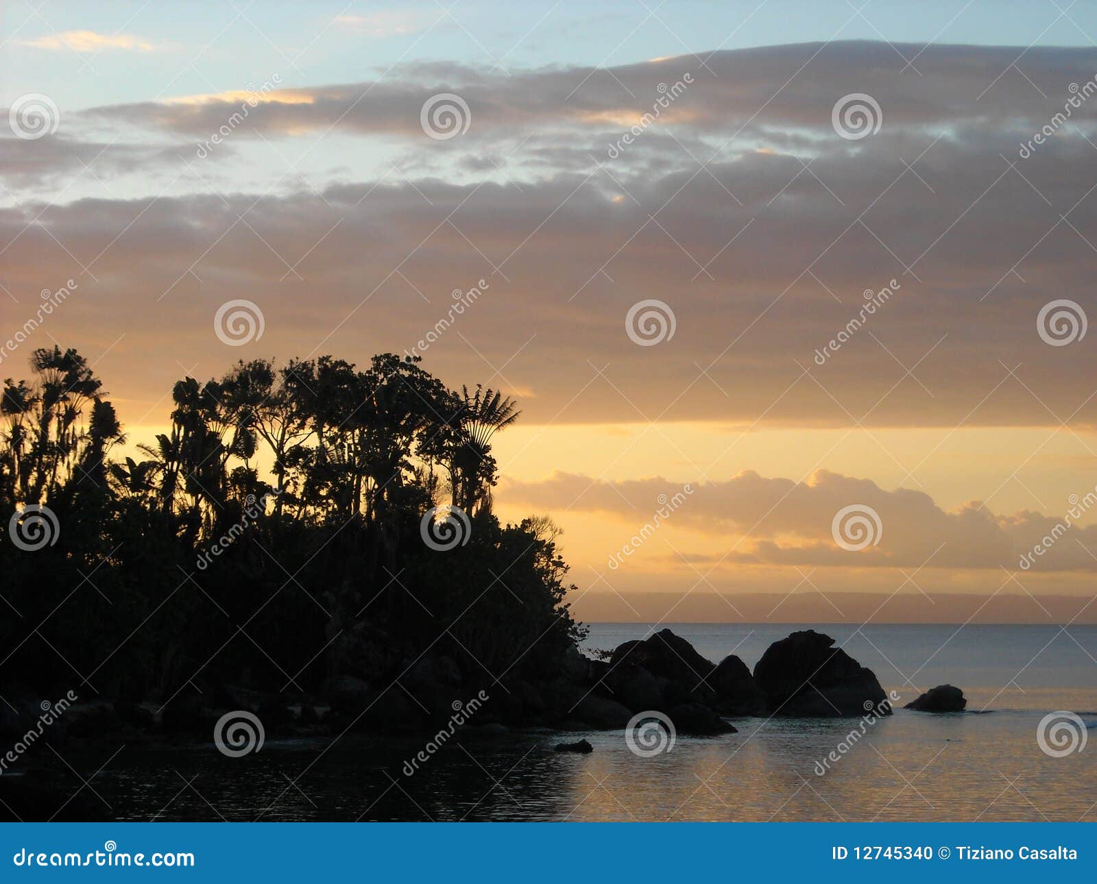 Sunset in Madagascar stock photo. Image of calm, palm - 12745340
