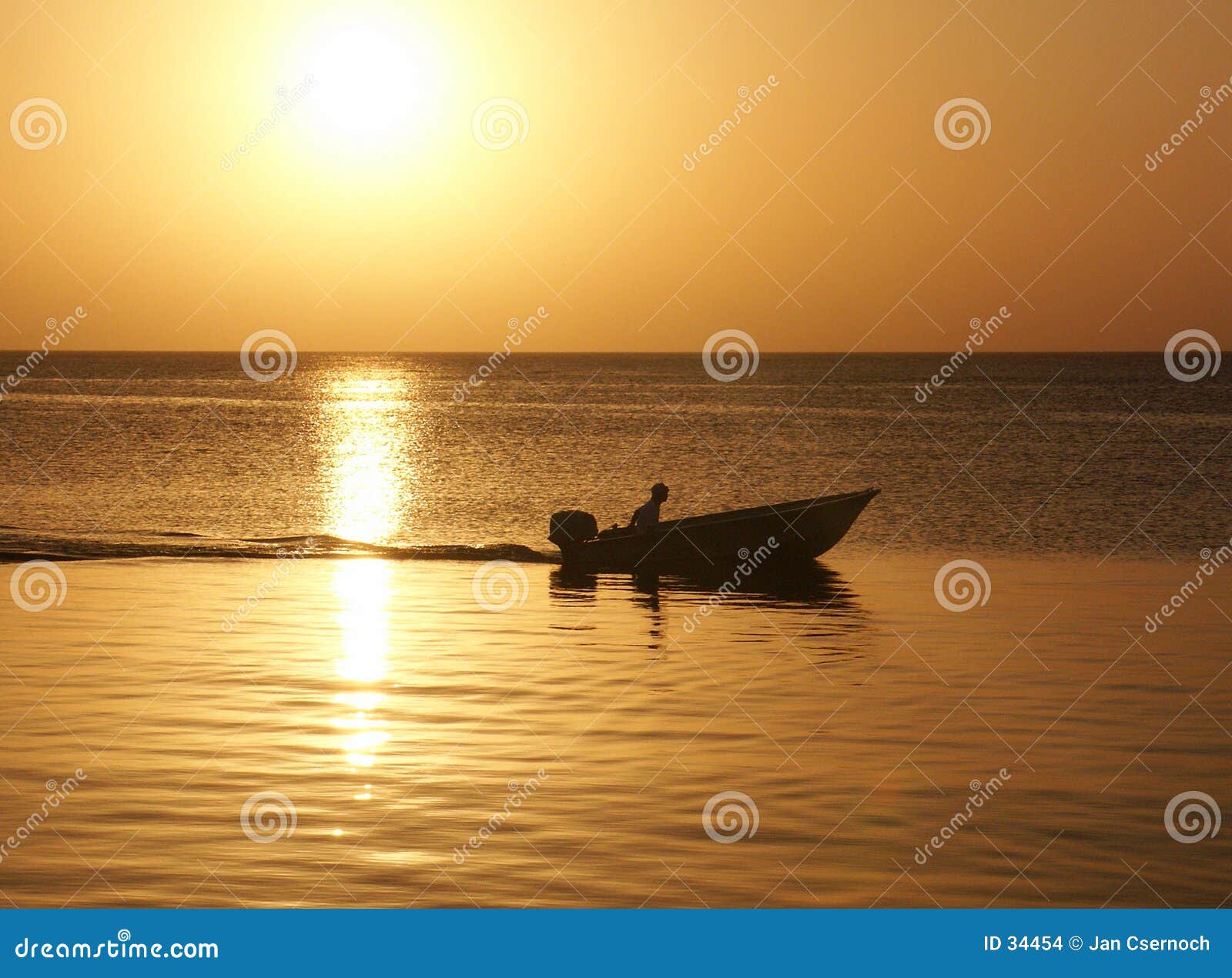 Sunset with man in boat stock photo. Image of shadow, ocean - 34454