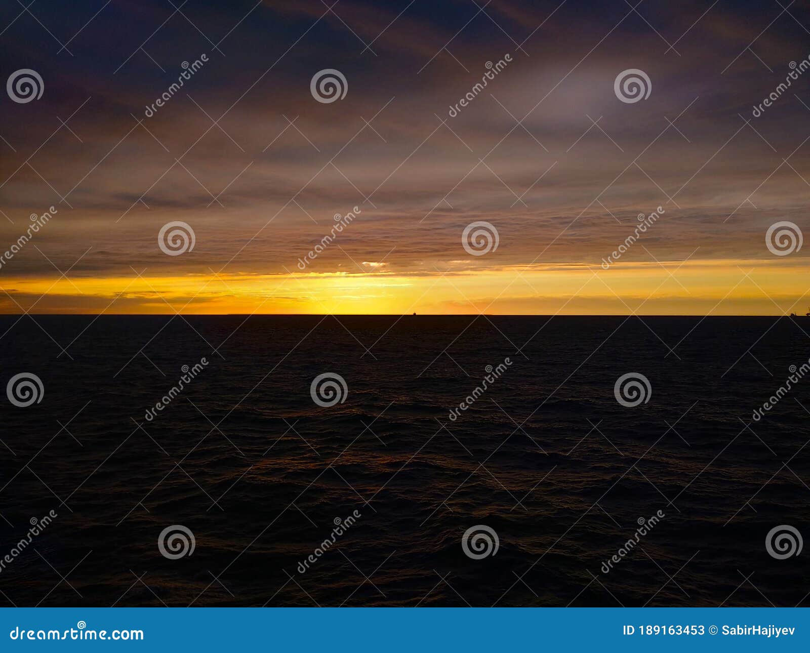Sunset in the Middle of the Sea. Stock Image - Image of cloudscape ...