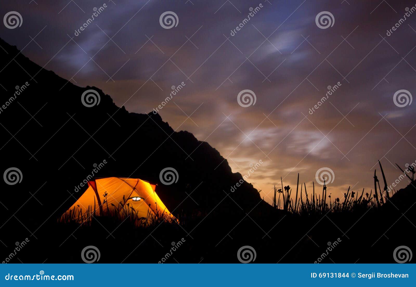 Sunset in Mountains with Tent Highlighted Stock Photo - Image of ...
