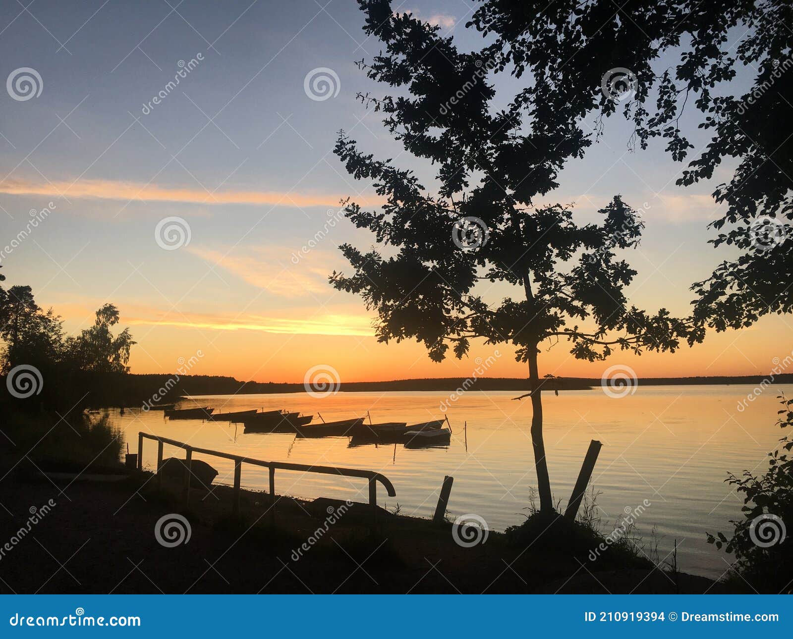 Sunset stock photo. Image of boats, sunset, nice, lake - 210919394