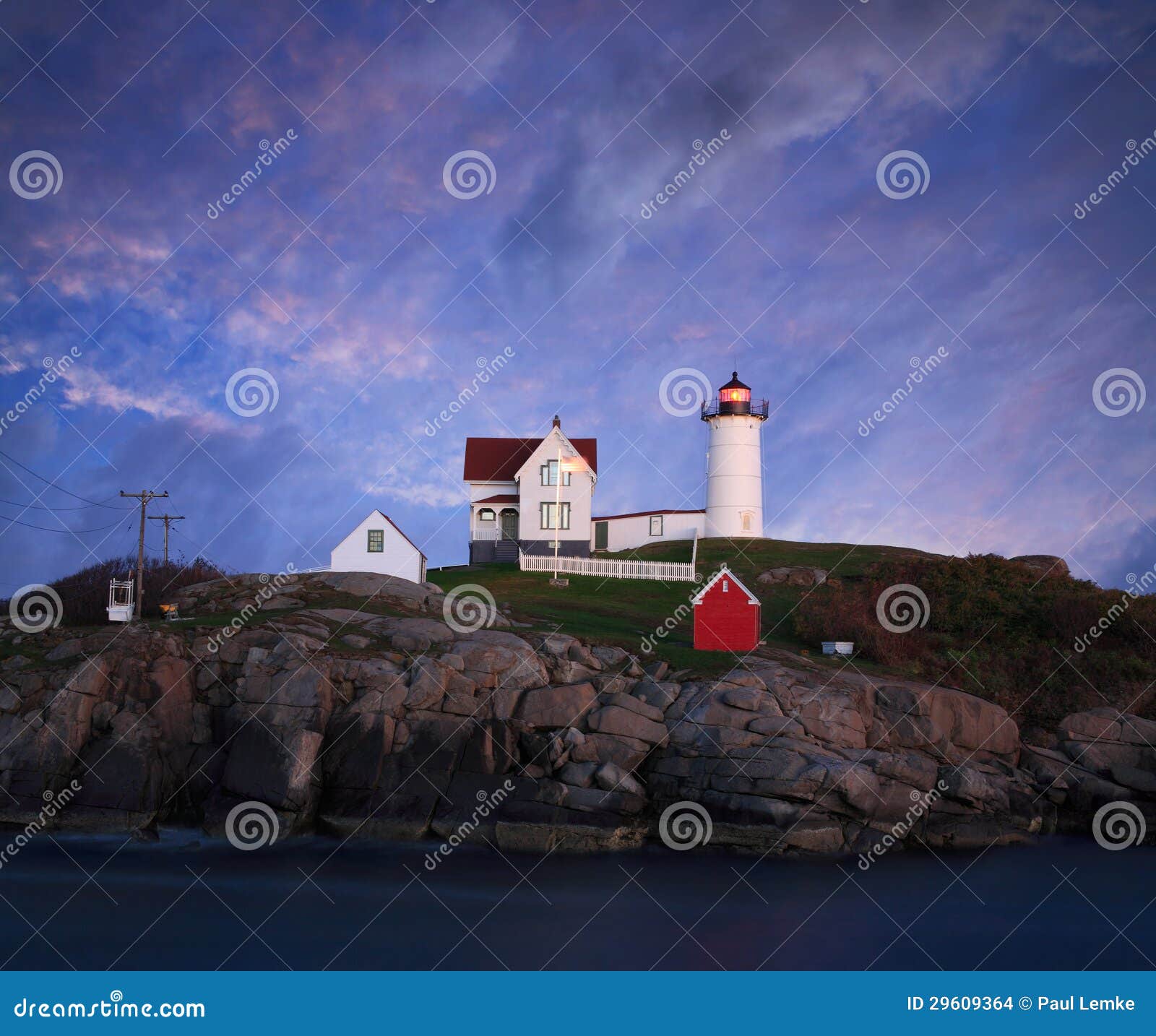 Sunset at the Nubble Light stock photo. Image of cloudy - 29609364