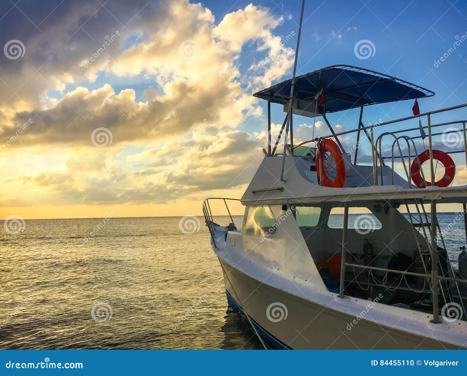 Sunset on ocean with boat. stock photo. Image of outdoor - 84455110