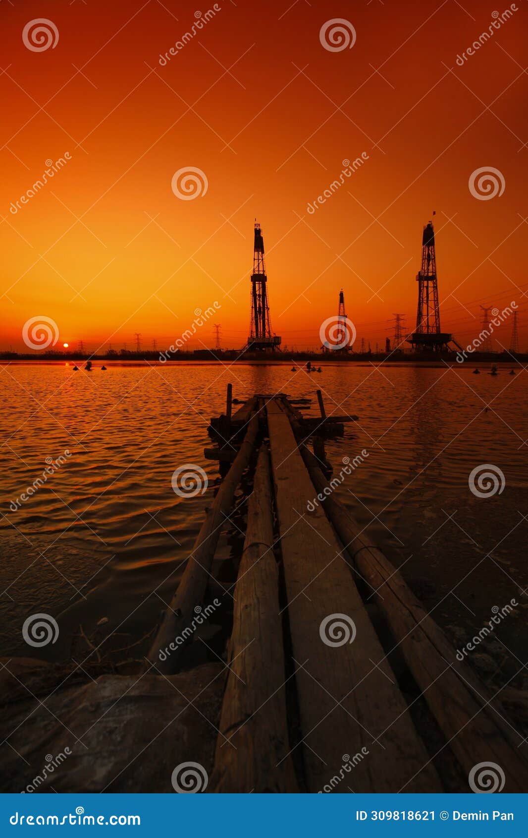 Sunset of Oil Drilling Rig in the Sea Stock Image - Image of electric ...