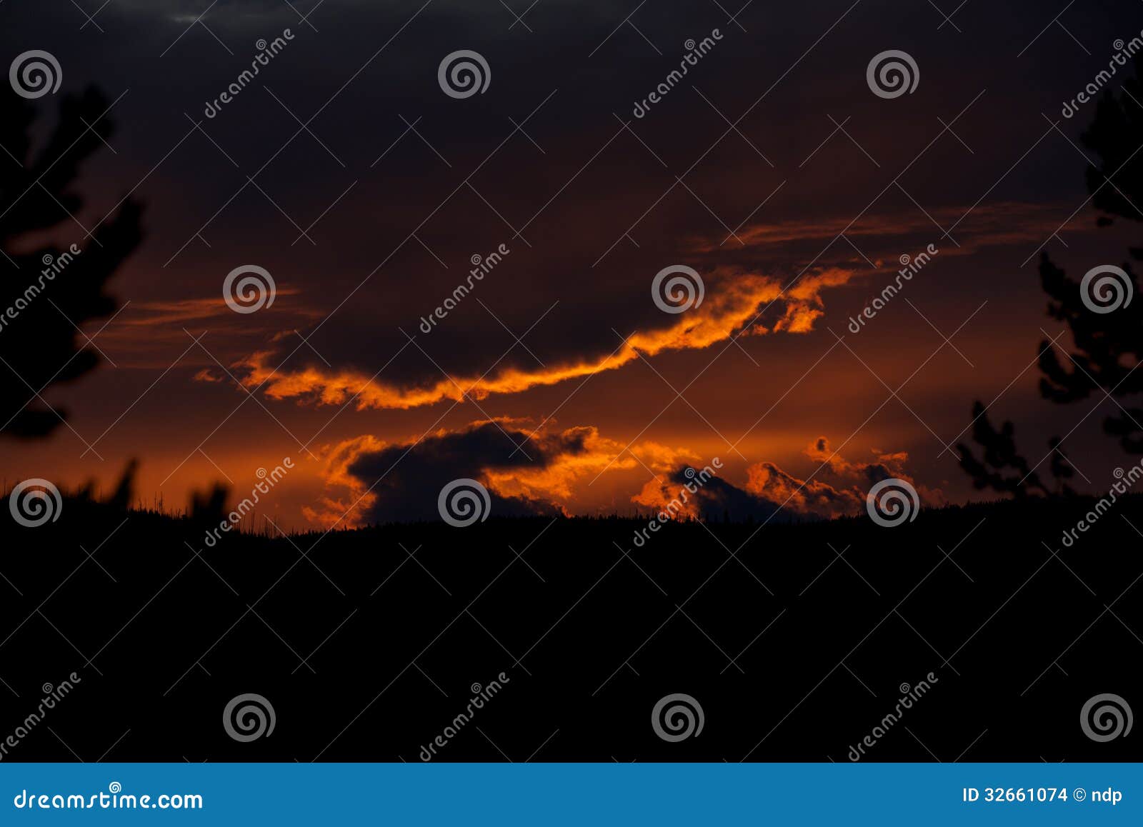 Sunset at Old Faithful stock photo. Image of silhouette - 32661074