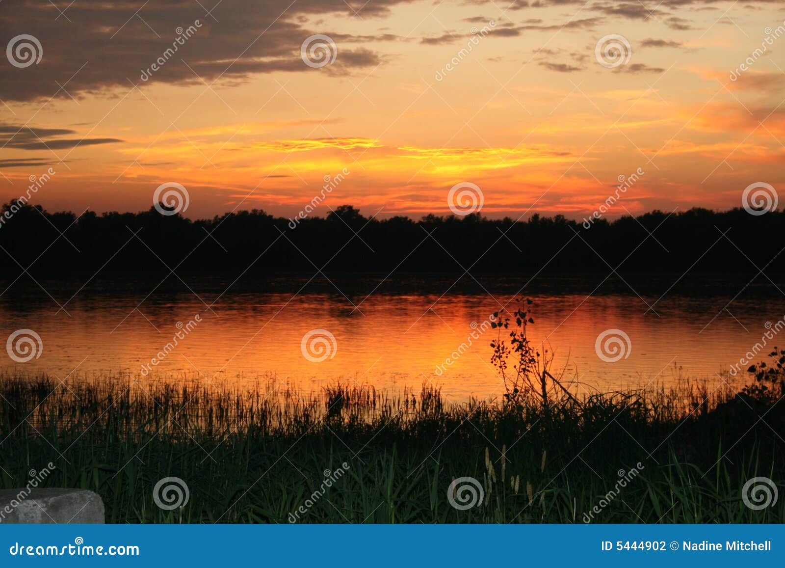 Sunset on an oval lake stock photo. Image of natural, beautiful - 5444902