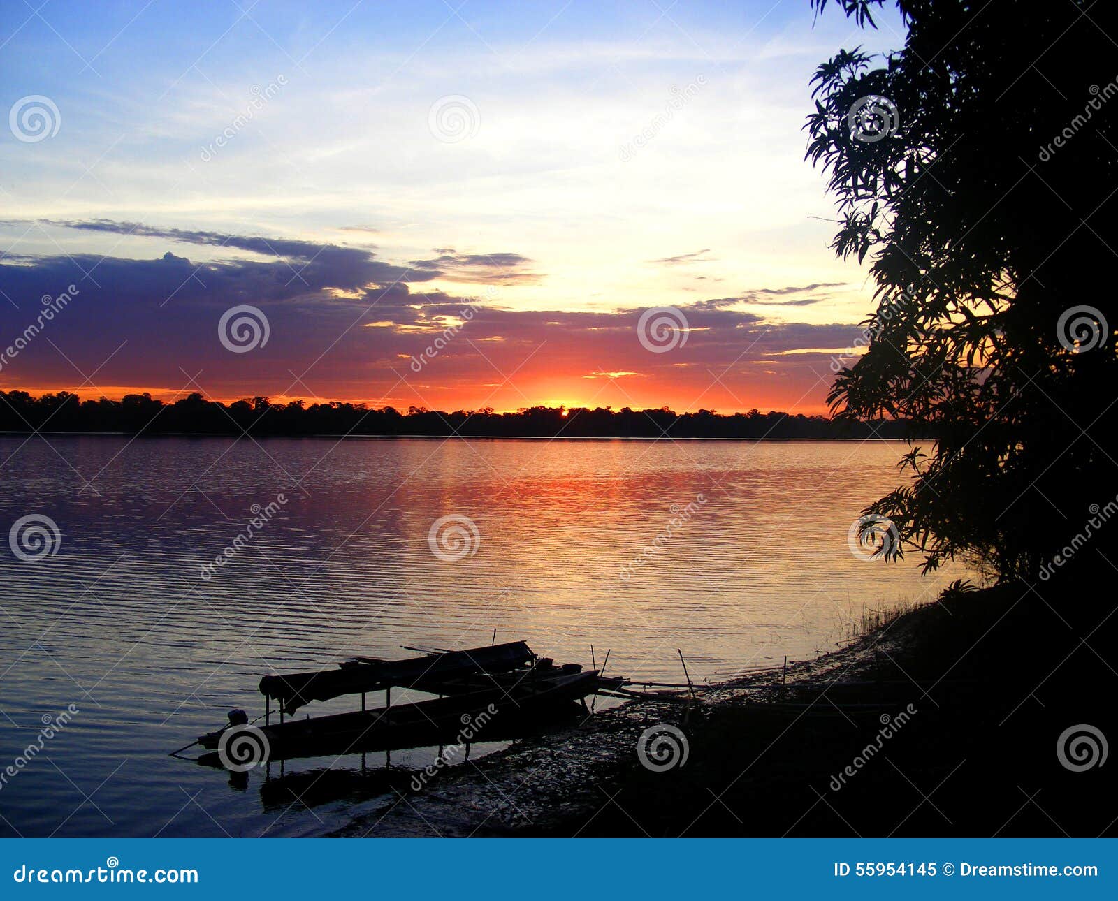 Sunset Over the Amazon River with a Wooden Boat Stock Image - Image of ...