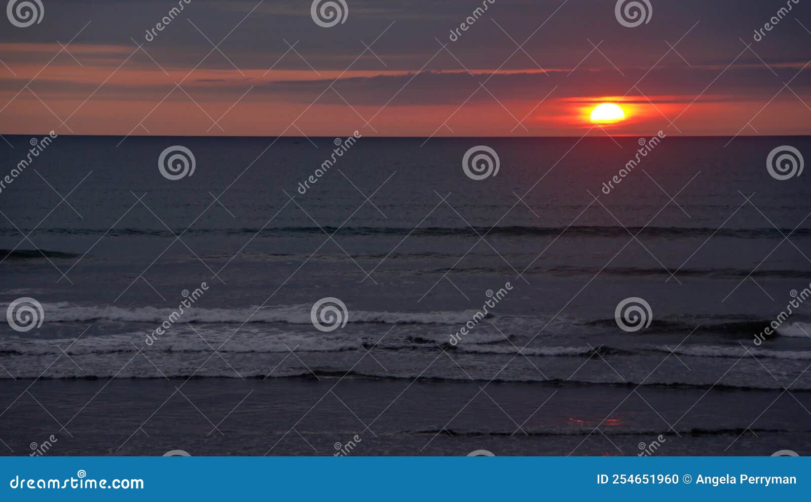 Sunset over the beach stock photo. Image of sunset, manabi - 254651960