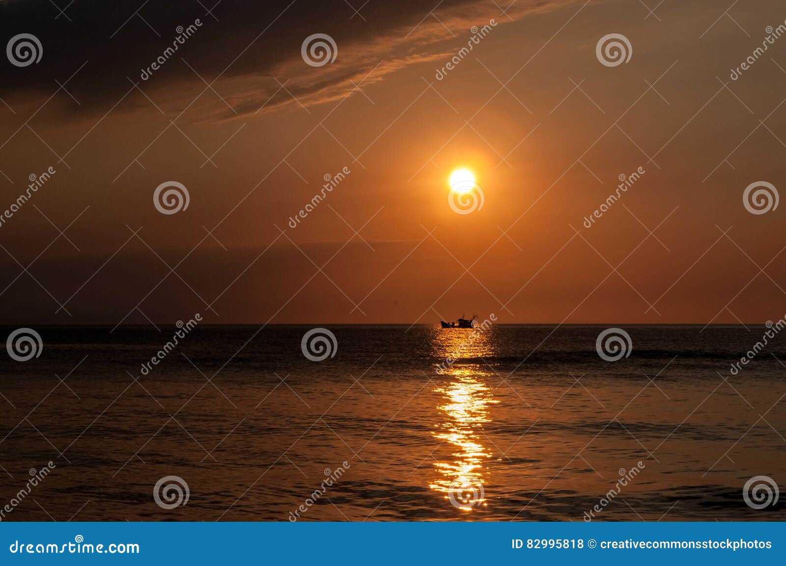 Sunset Over Boat On Water Picture. Image: 82995818