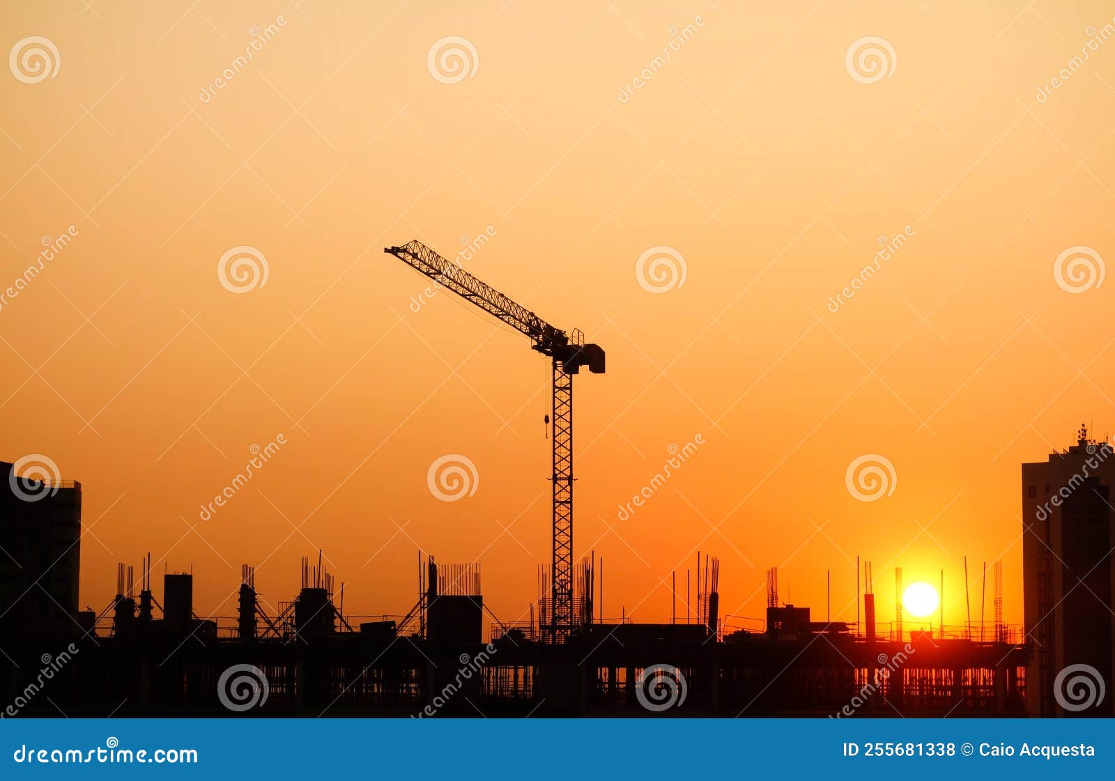 Sunset Over Building Construction in the City. Crane and Structure ...