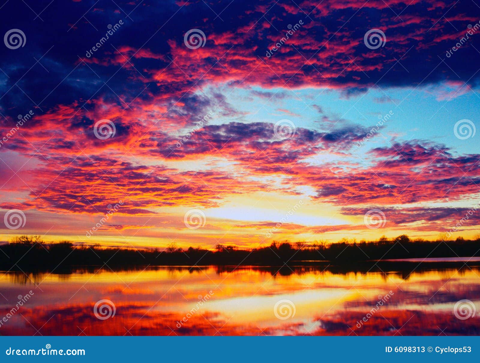 Sunset over calm lake stock image. Image of rise, lake - 6098313