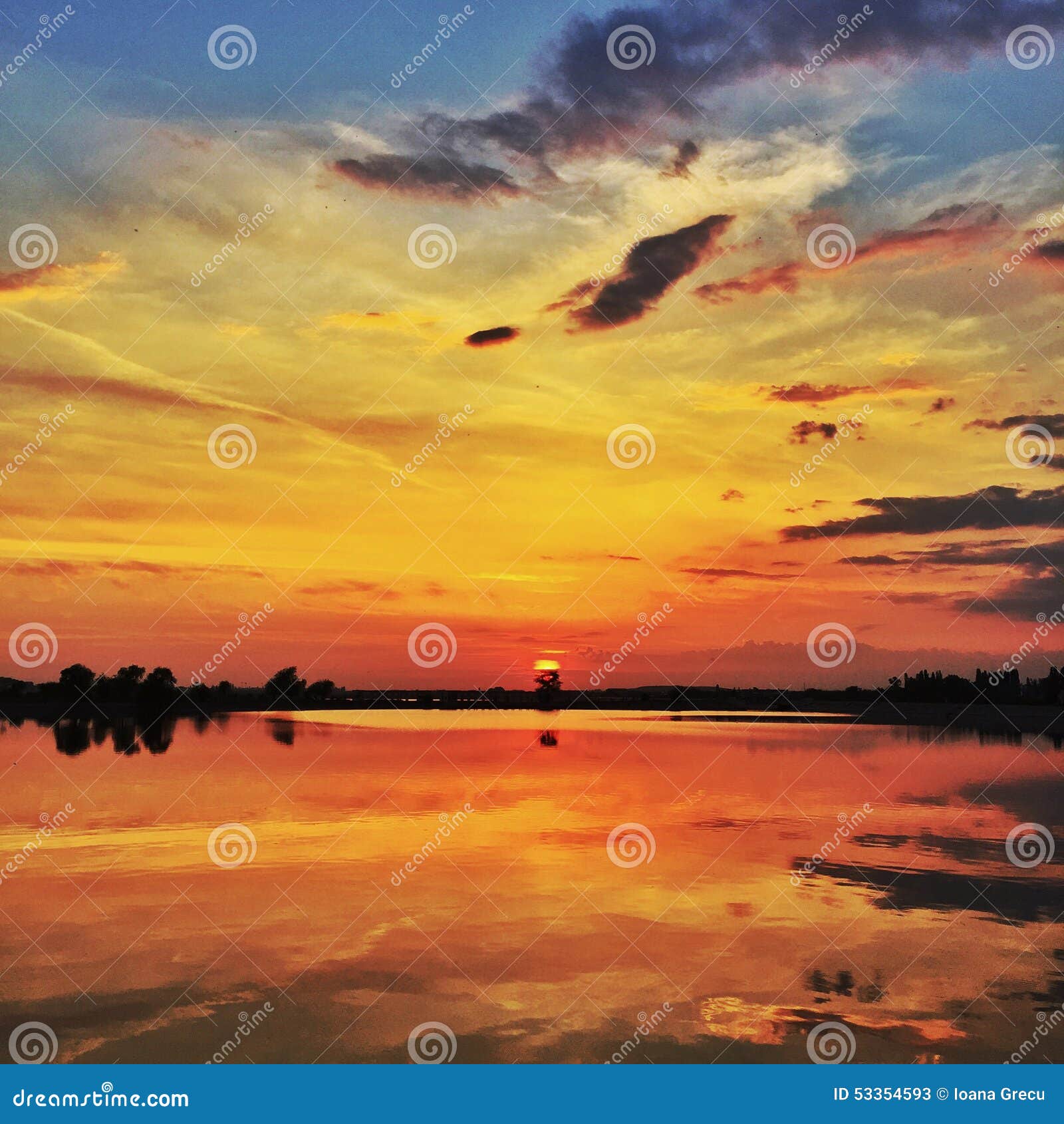 Sunset over calm lake stock image. Image of lake, water - 53354593