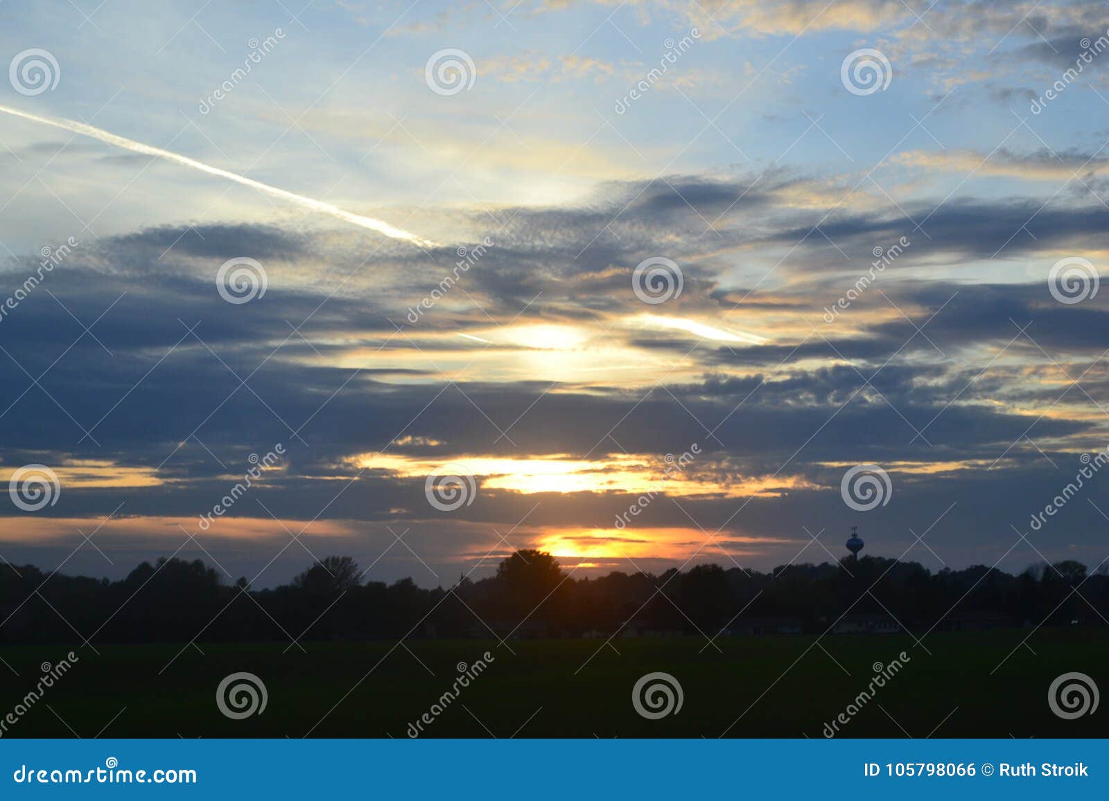 Sunset through Clouds Over Field Stock Photo - Image of wisconsin ...