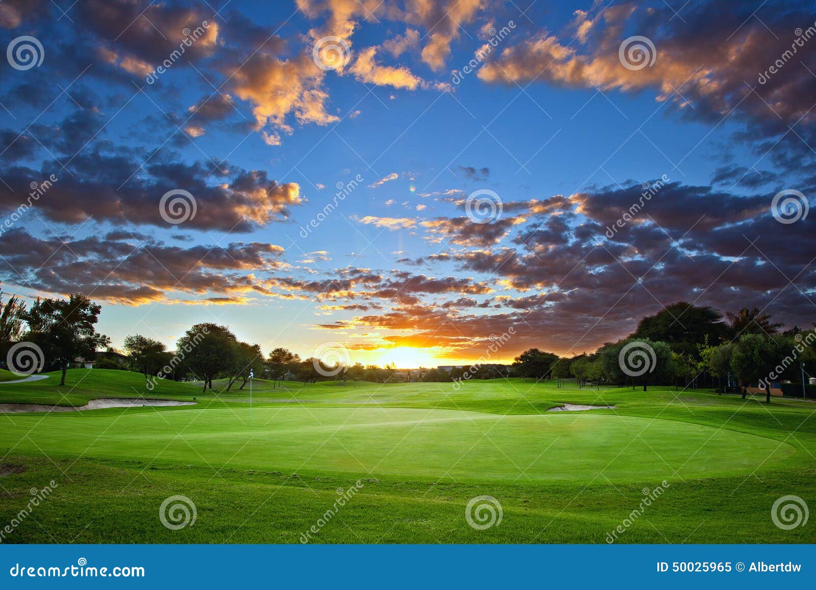Sunset over golf course stock image. Image of sunrise - 50025965