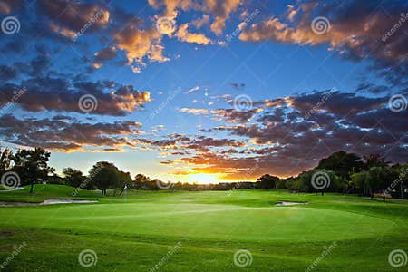 Sunset over golf course stock image. Image of sunrise - 50025965