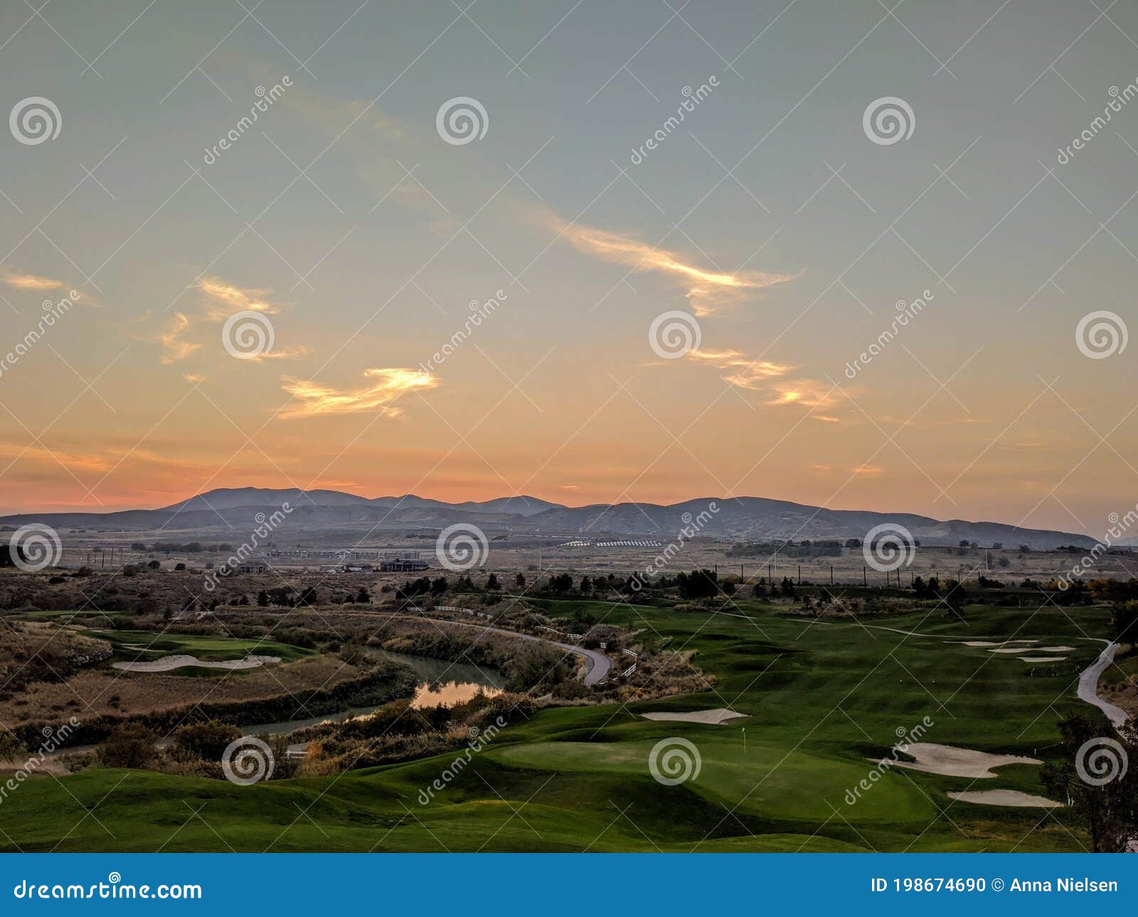Sunset over golf course stock photo. Image of golf, mountains - 198674690