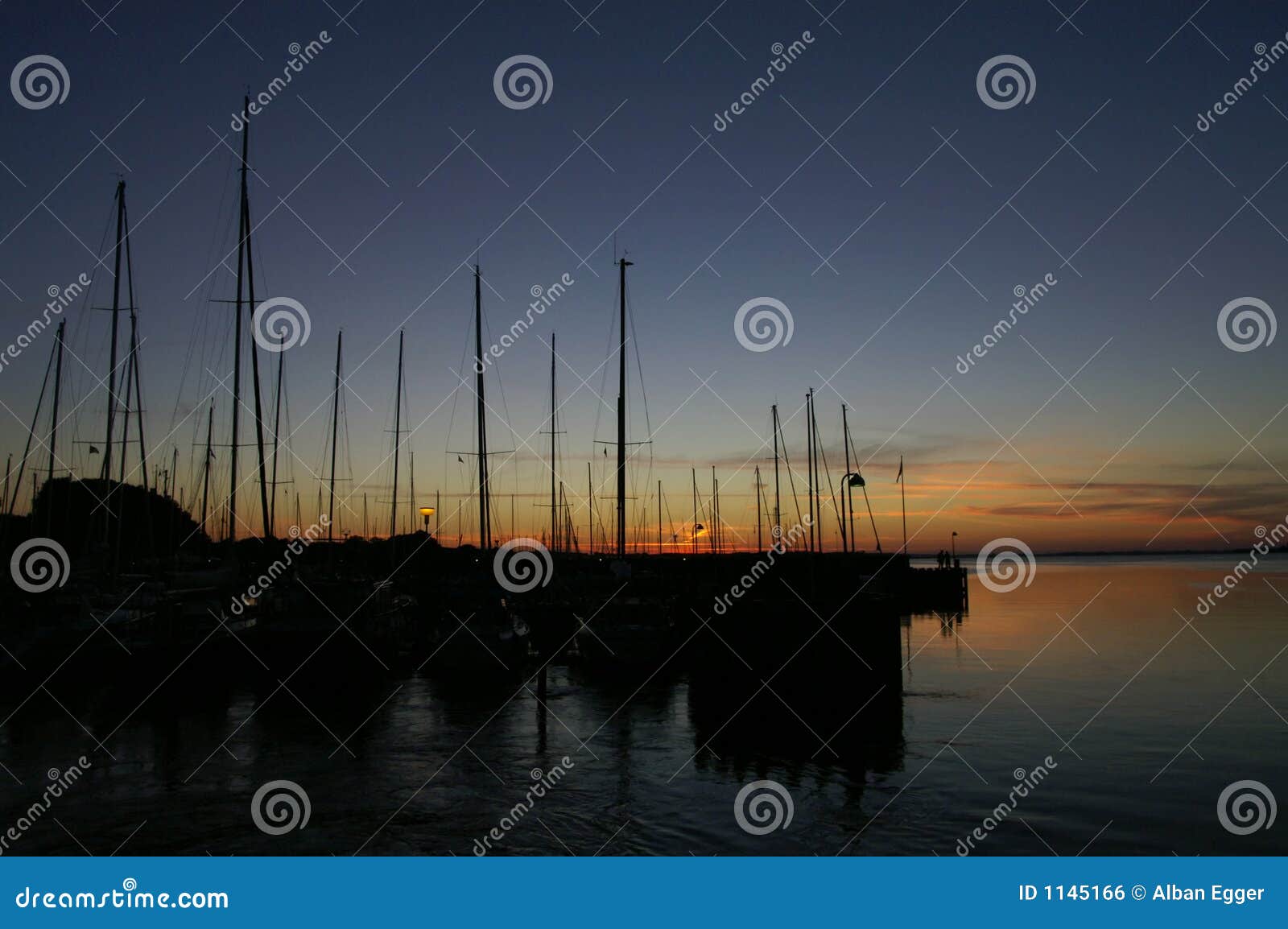 Sunset over harbor stock photo. Image of sunrise, idyllic - 1145166