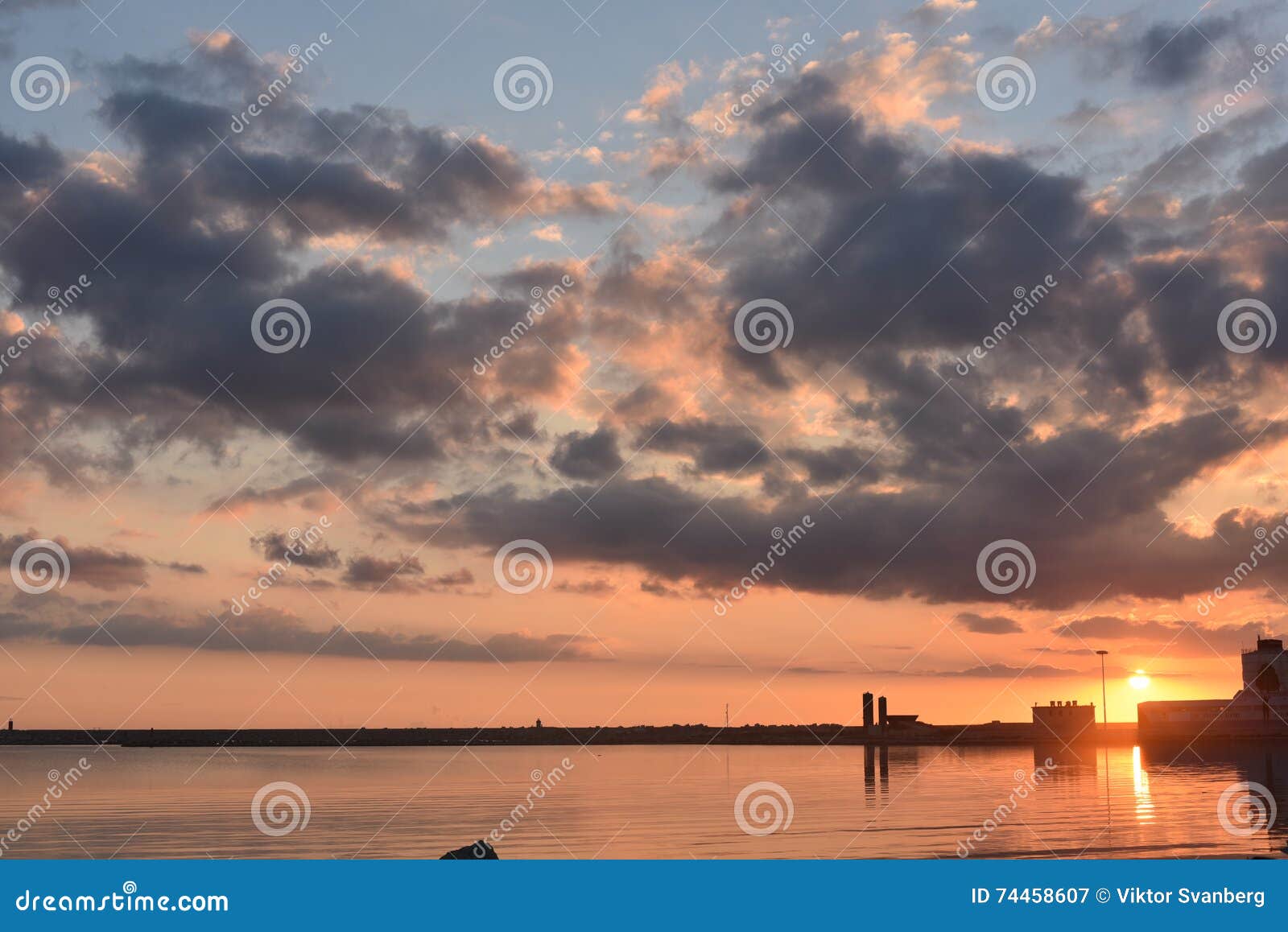 Sunset over the harbor editorial photography. Image of orange - 74458607
