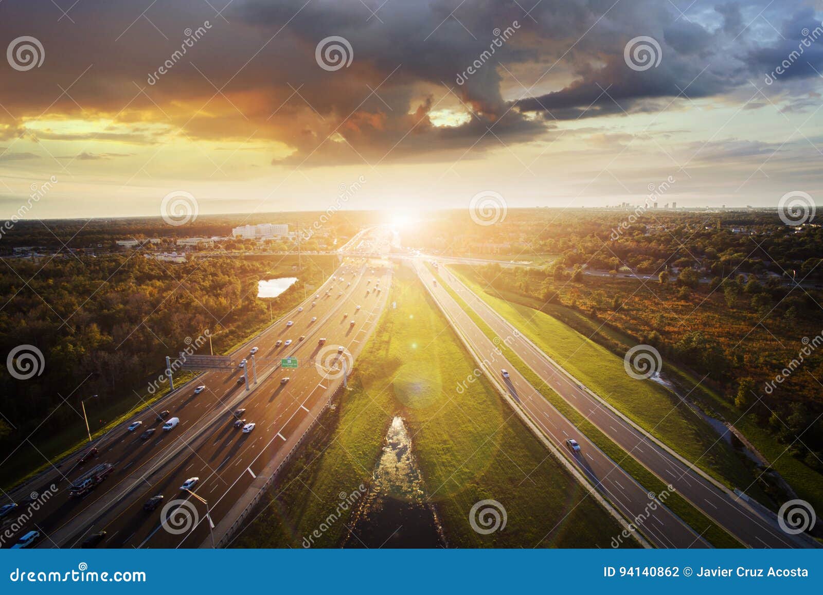 Sunset over the highway stock photo. Image of dawn, trees - 94140862