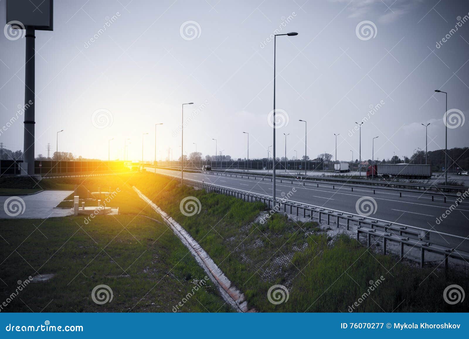 Sunset over highway stock image. Image of urban, grass - 76070277
