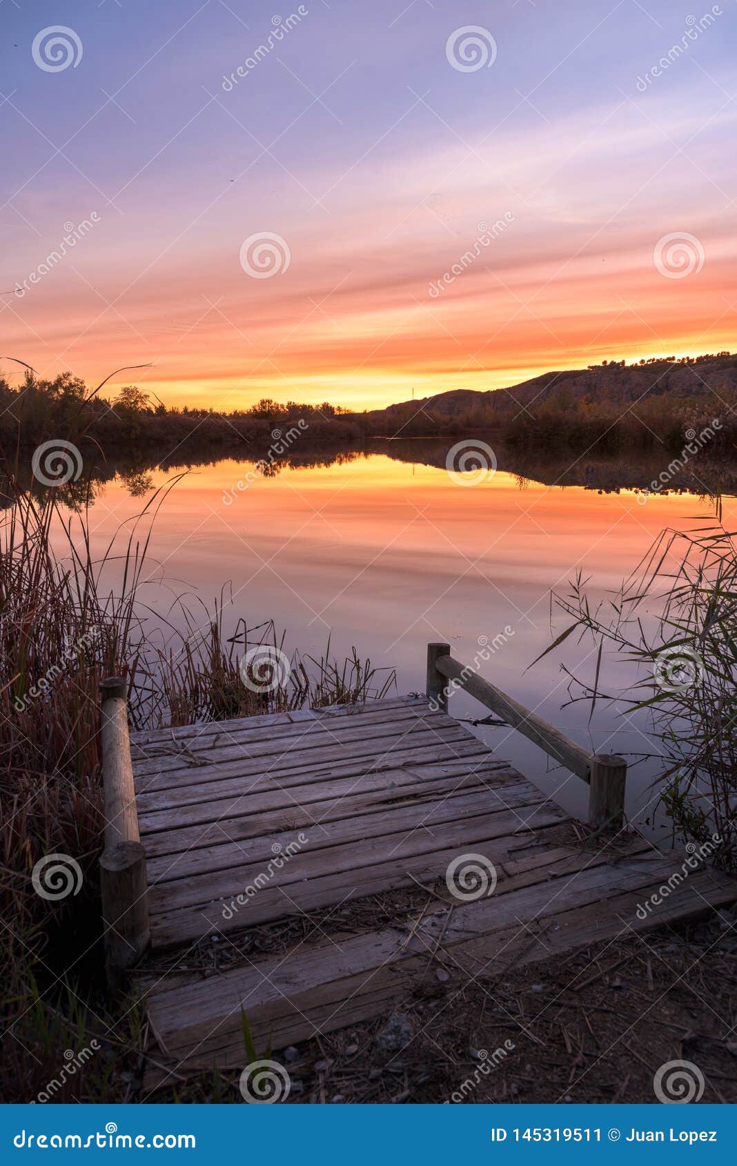 Sunset over a lagoon stock image. Image of tranquility - 145319511