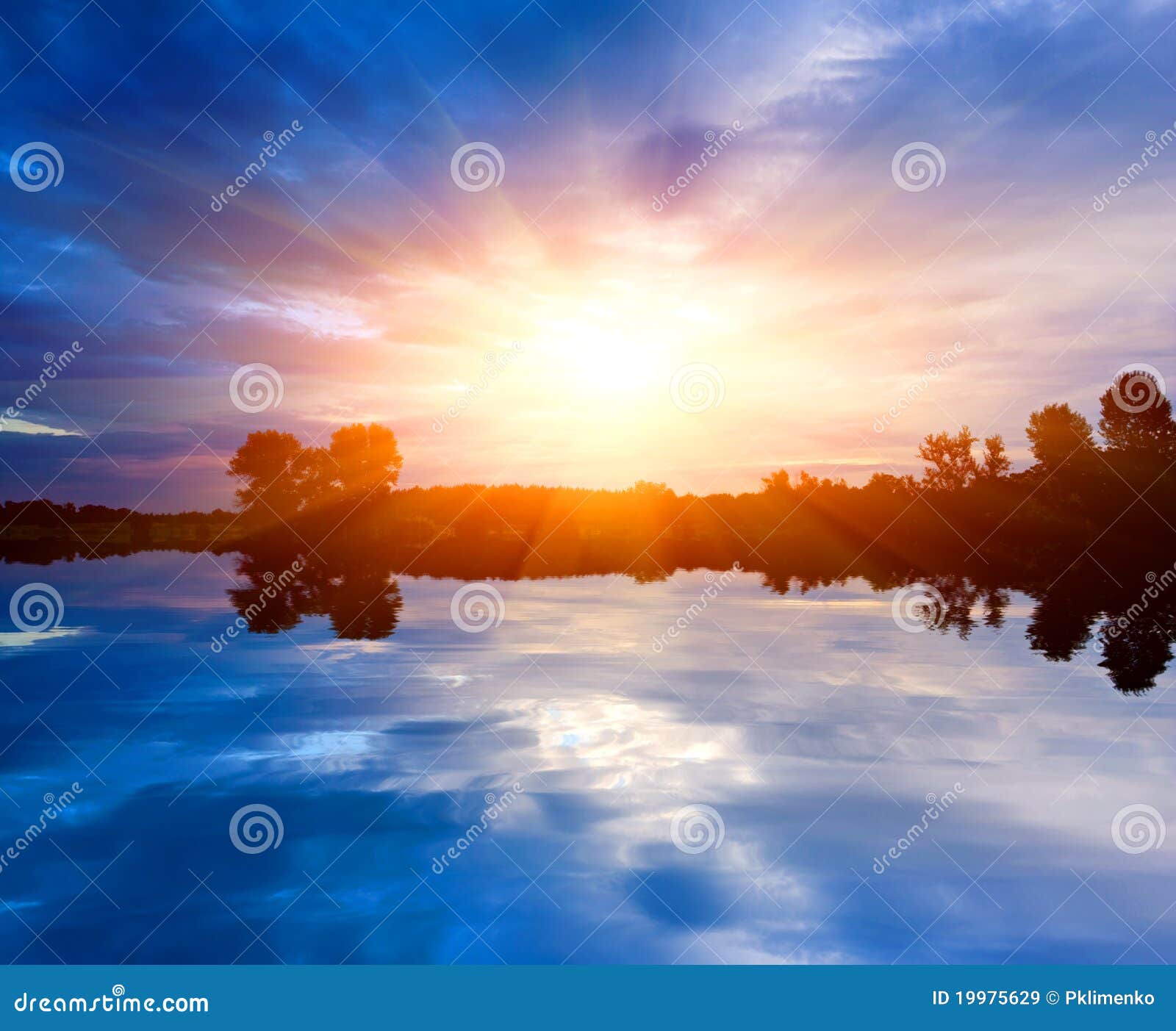 Sunset over lake stock image. Image of skyline, calm - 19975629