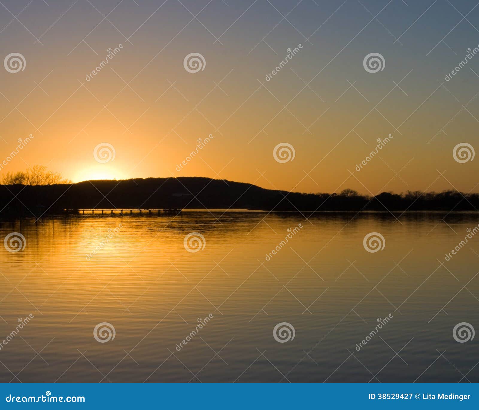 Sunset Over a Lake stock image. Image of yellow, water - 38529427