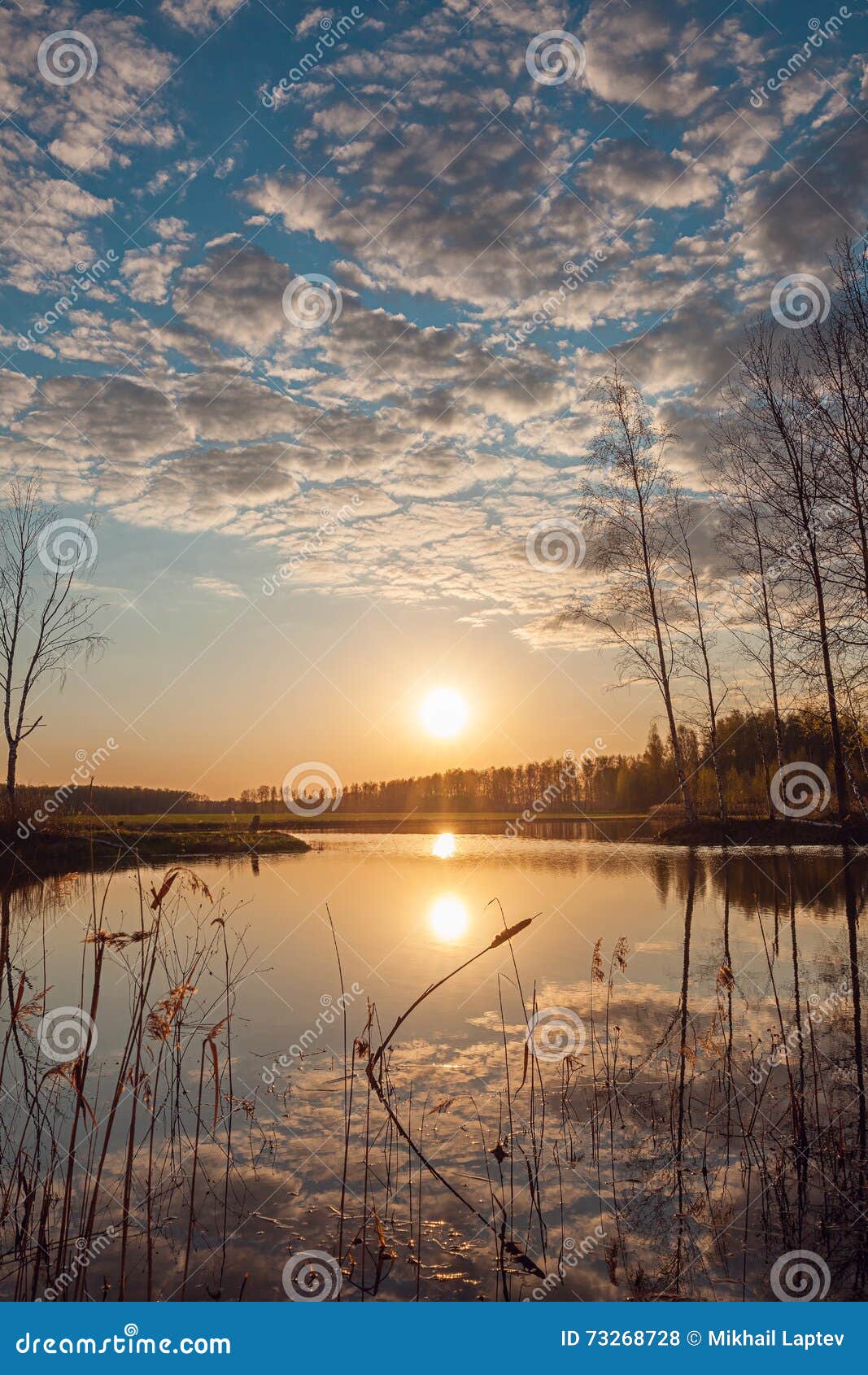Sunset over the lake stock photo. Image of cloudscape - 73268728