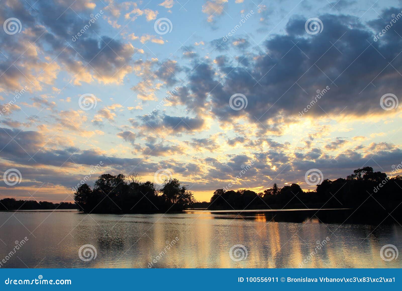 Sunset over the lake stock image. Image of lake, naturally - 100556911