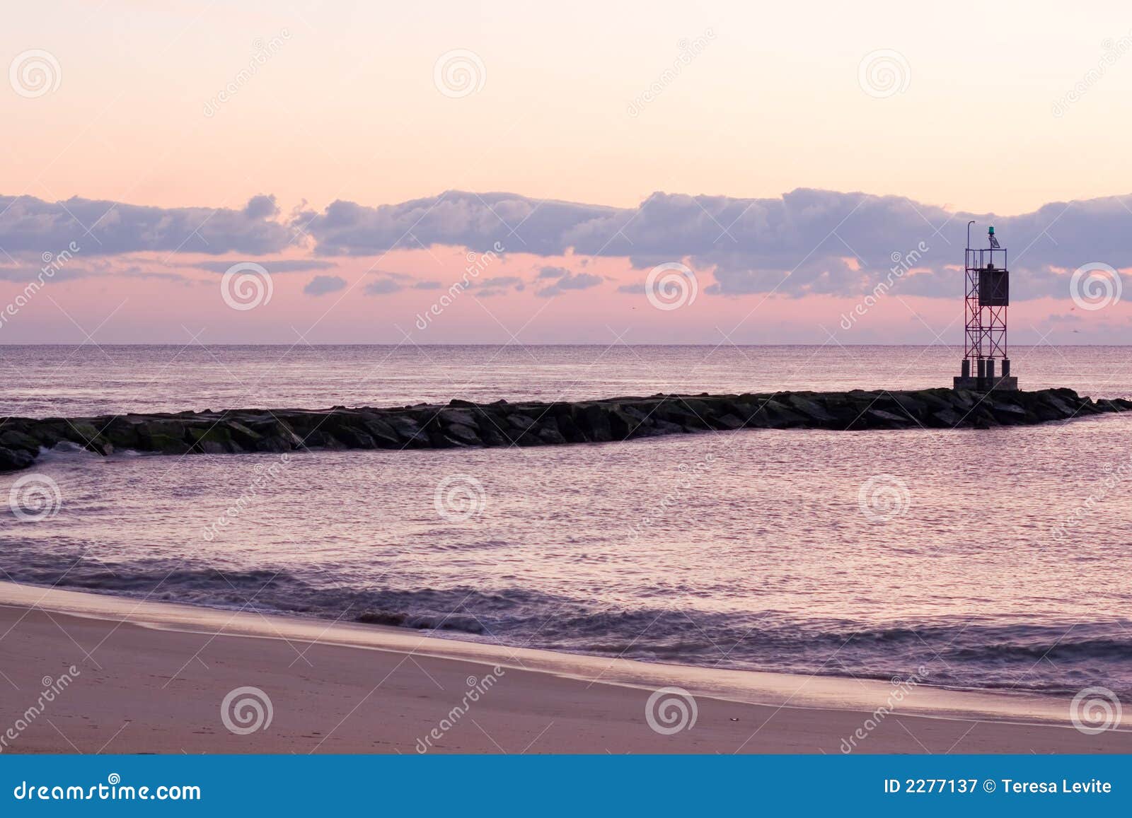Sunset over mole on beach stock image. Image of colorful - 2277137