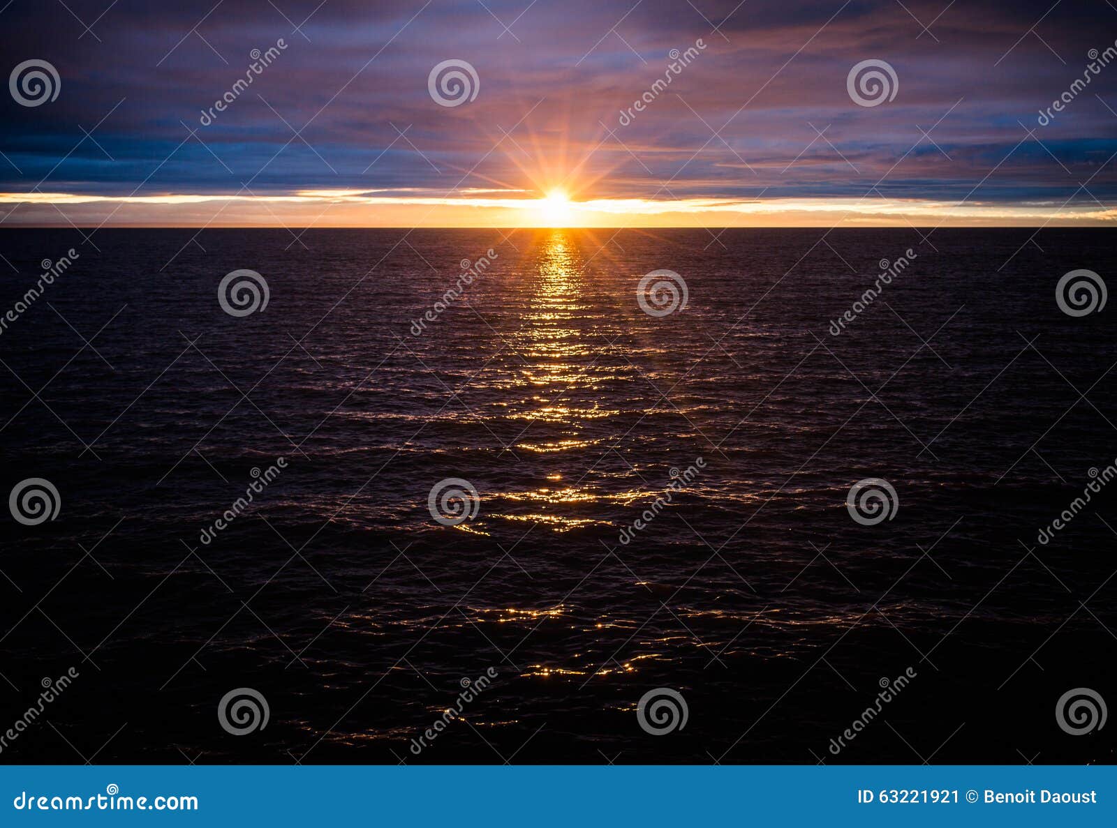 Sunset Over Ocean on a Dark Cloudy Evening Stock Image - Image of ...