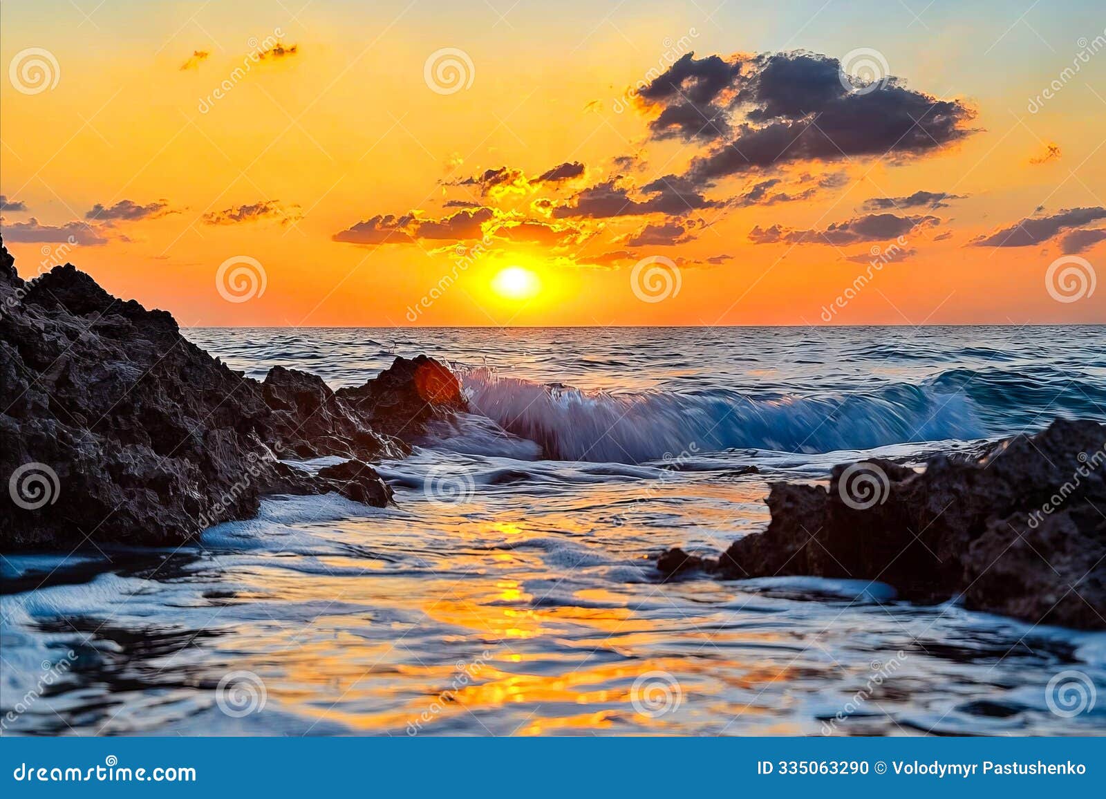 A Sunset Over the Ocean with Rocks in the Foreground Stock Photo - Image of hues, ocean: 335063290