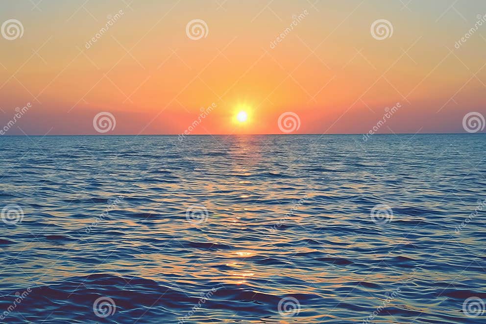 Sunset Over the Ocean with Visible Sun on Horizon. Stock Image - Image ...